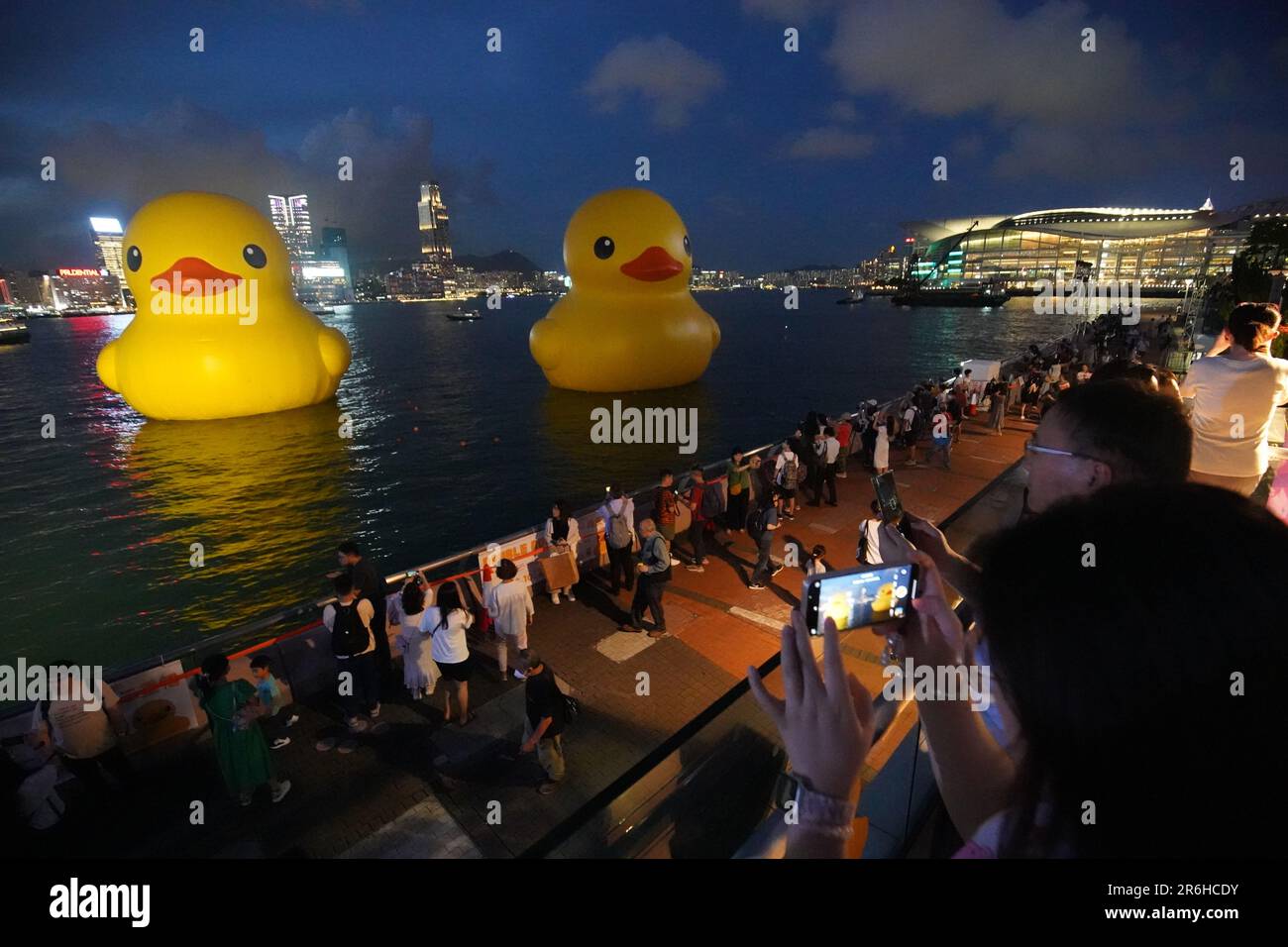 Hong Kong, Hong Kong. 09th June, 2023. People take photos in front of two enormous inflatable ...