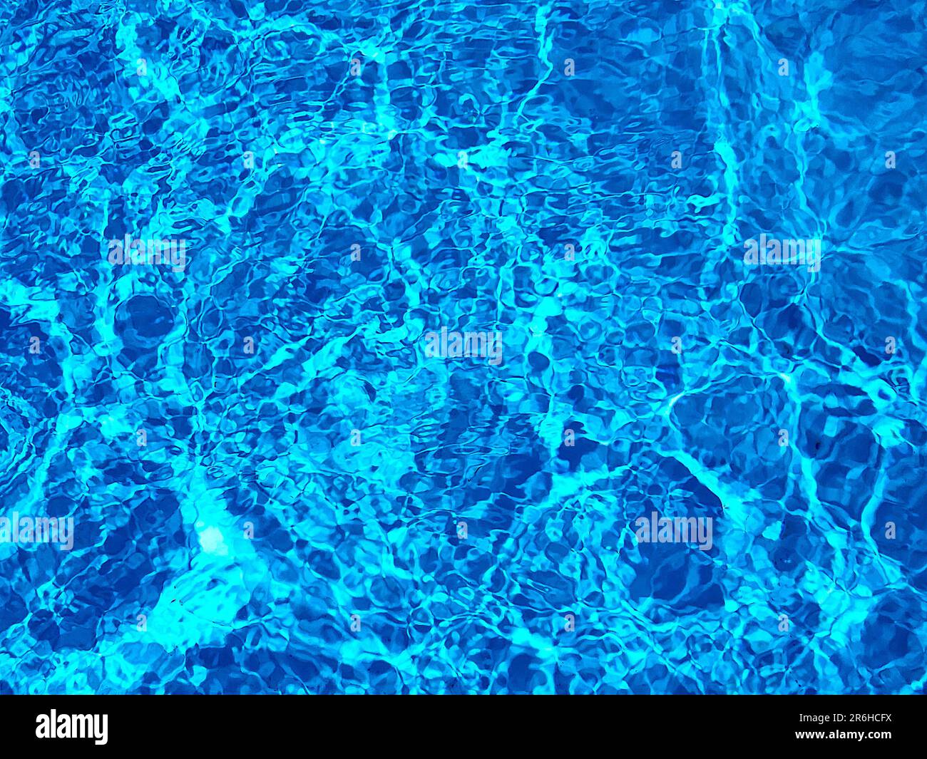 Abstract design of turquoise swimming pool water with sunshine ...
