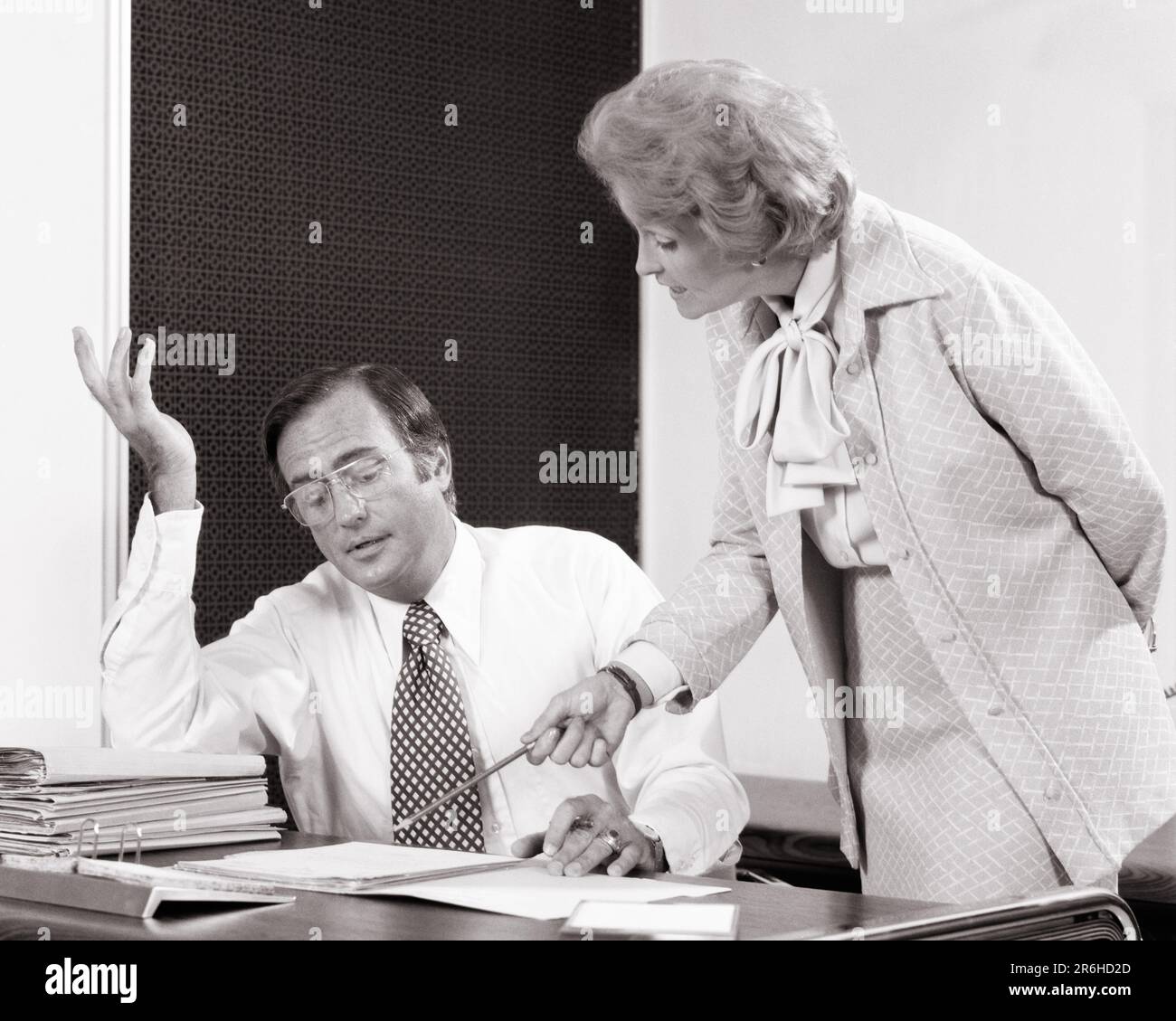 1970s MAN AND WOMAN WORKING TOGETHER AT DESK WITH FILES PAPERS - o4113 ...