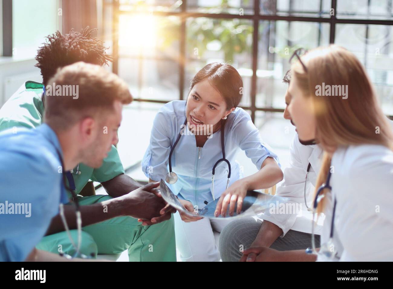 Group of multiethnic doctors looking at x-ray Stock Photo - Alamy