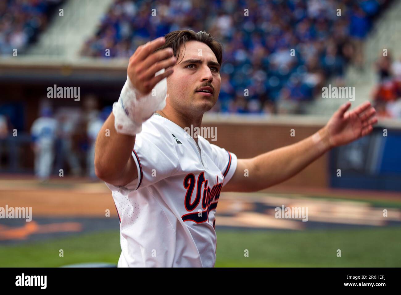 Virginia starting pitcher Nick Parker motivates Virginia fans during an ...