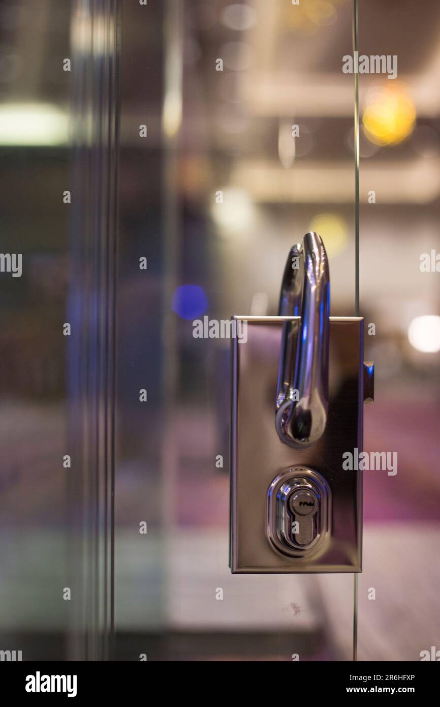 open glass door with glass lock, glass door of a convention hall ...