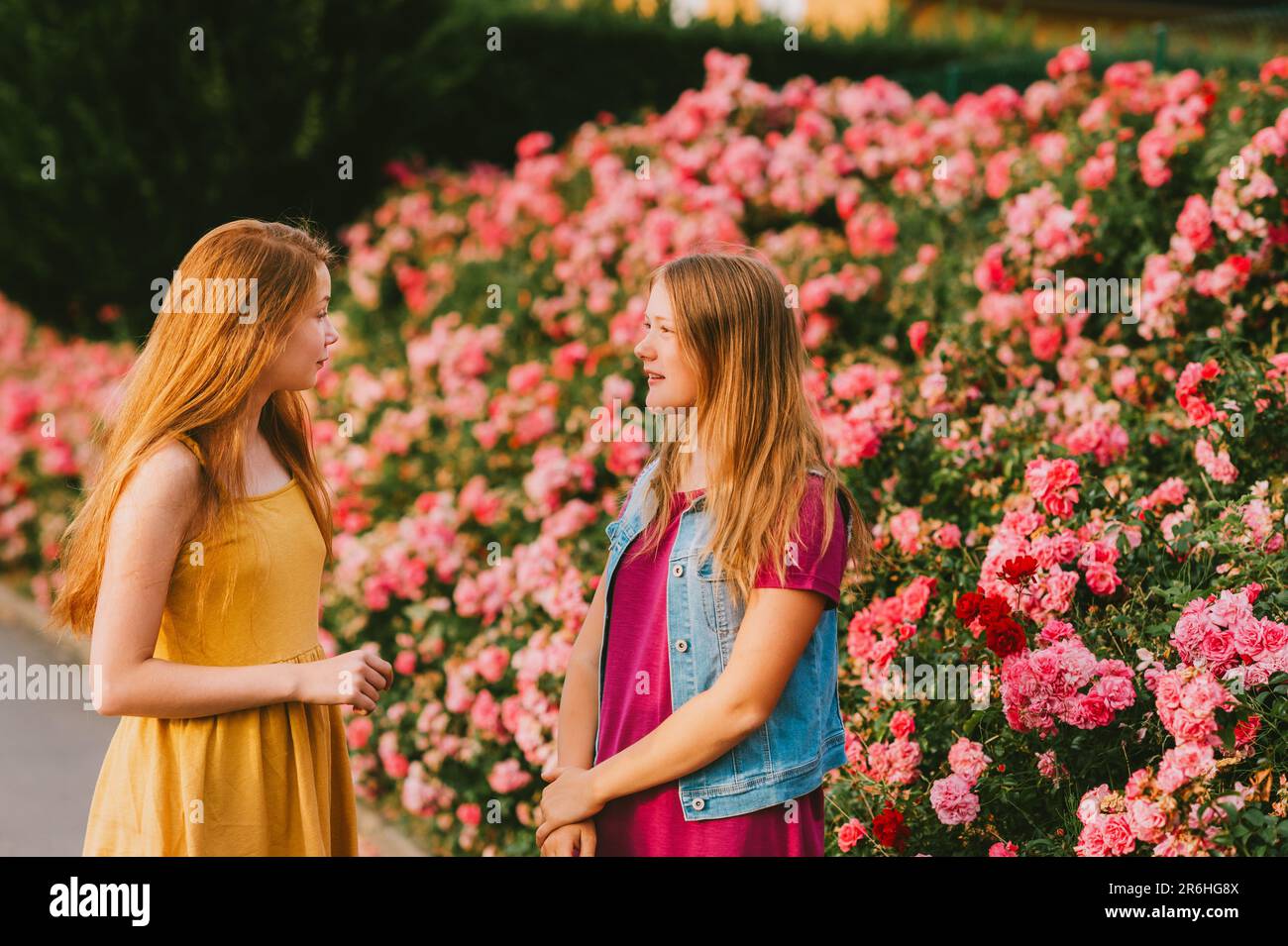 Outdoor portrait of two teen girls talking together outside Stock Photo ...
