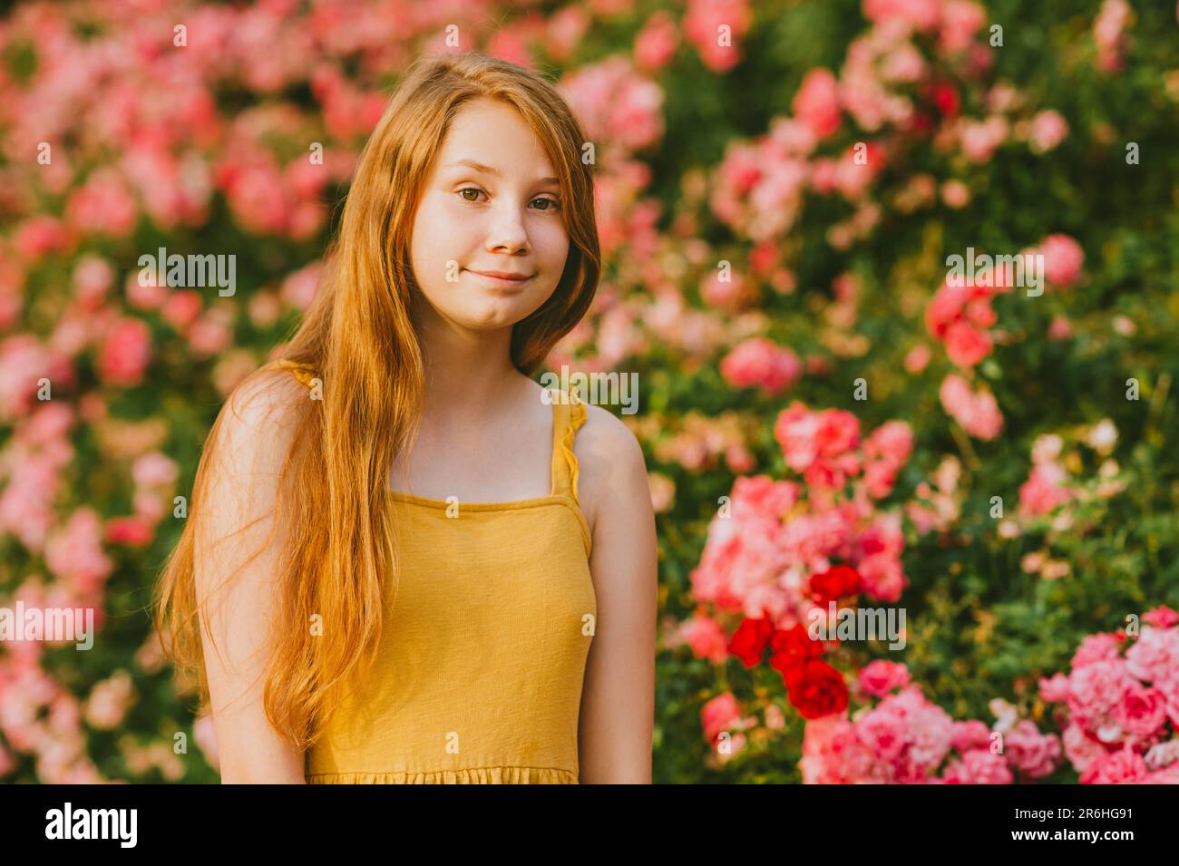 Outdoor portrait of cute young girl with red hair, preteen child in ...