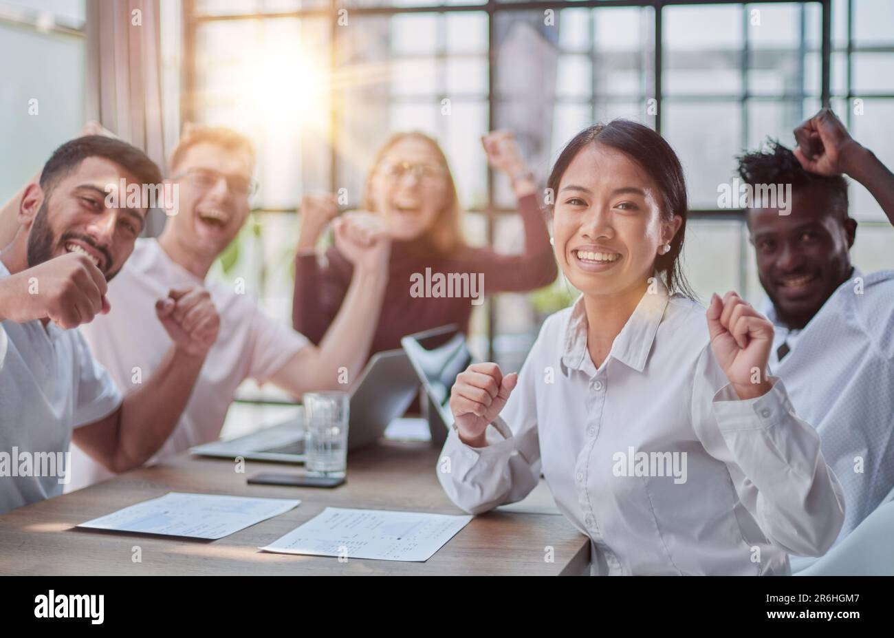 group of different business people celebrating victory while Stock ...