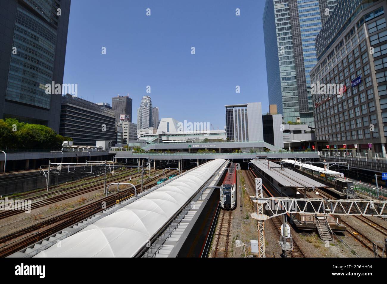 View along the many train tracks that enter the enormous Shinjuku Railway Station in Tokyo ...