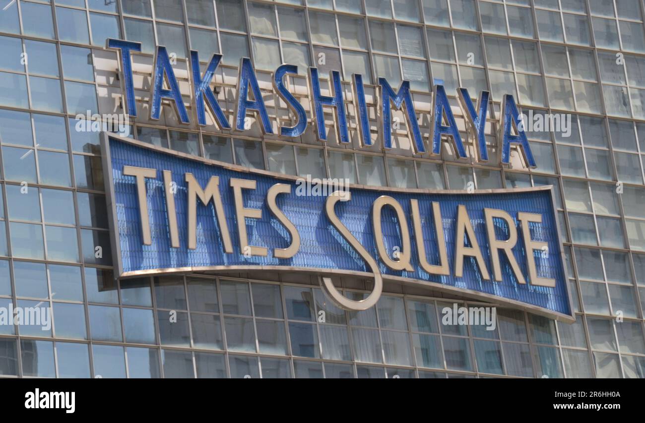 Vintage neon sign on the outside of a Tokyo building points the way to ...