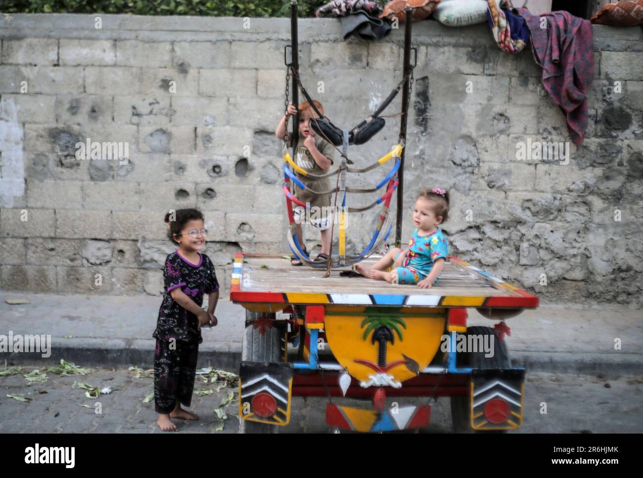 Palestine refugee children playing in front of their home in the ...