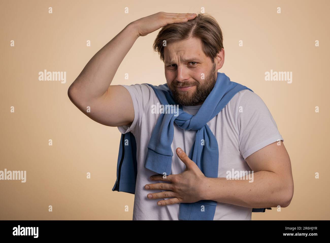 Comical funny young caucasian man making playful silly facial ...