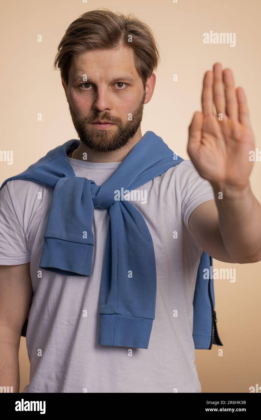 Angry man say No hold palm folded crossed hands in stop gesture ...