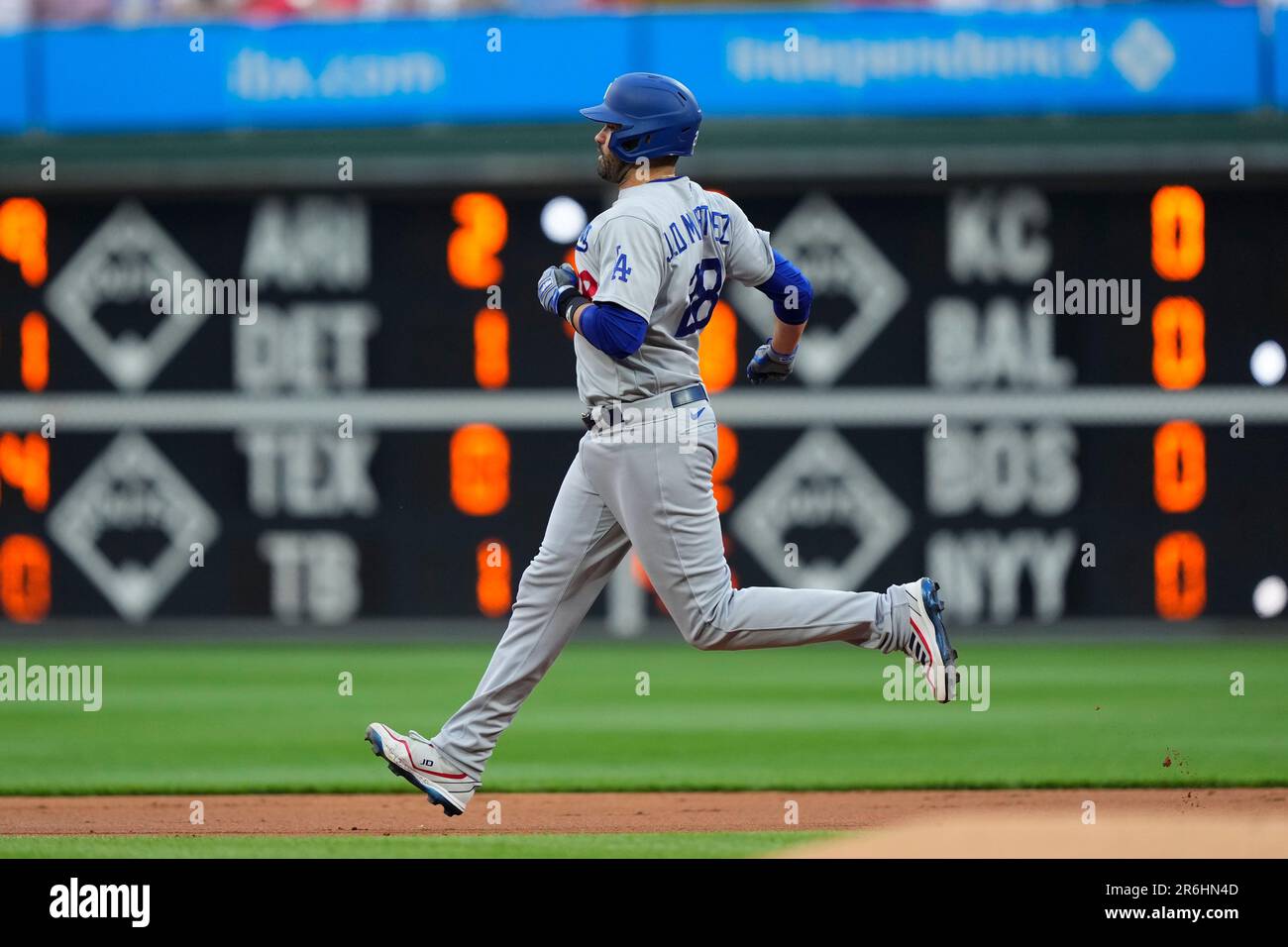 Los Angeles Dodgers' J.D. Martinez runs to second after hitting an RBI-double off Philadelphia ...