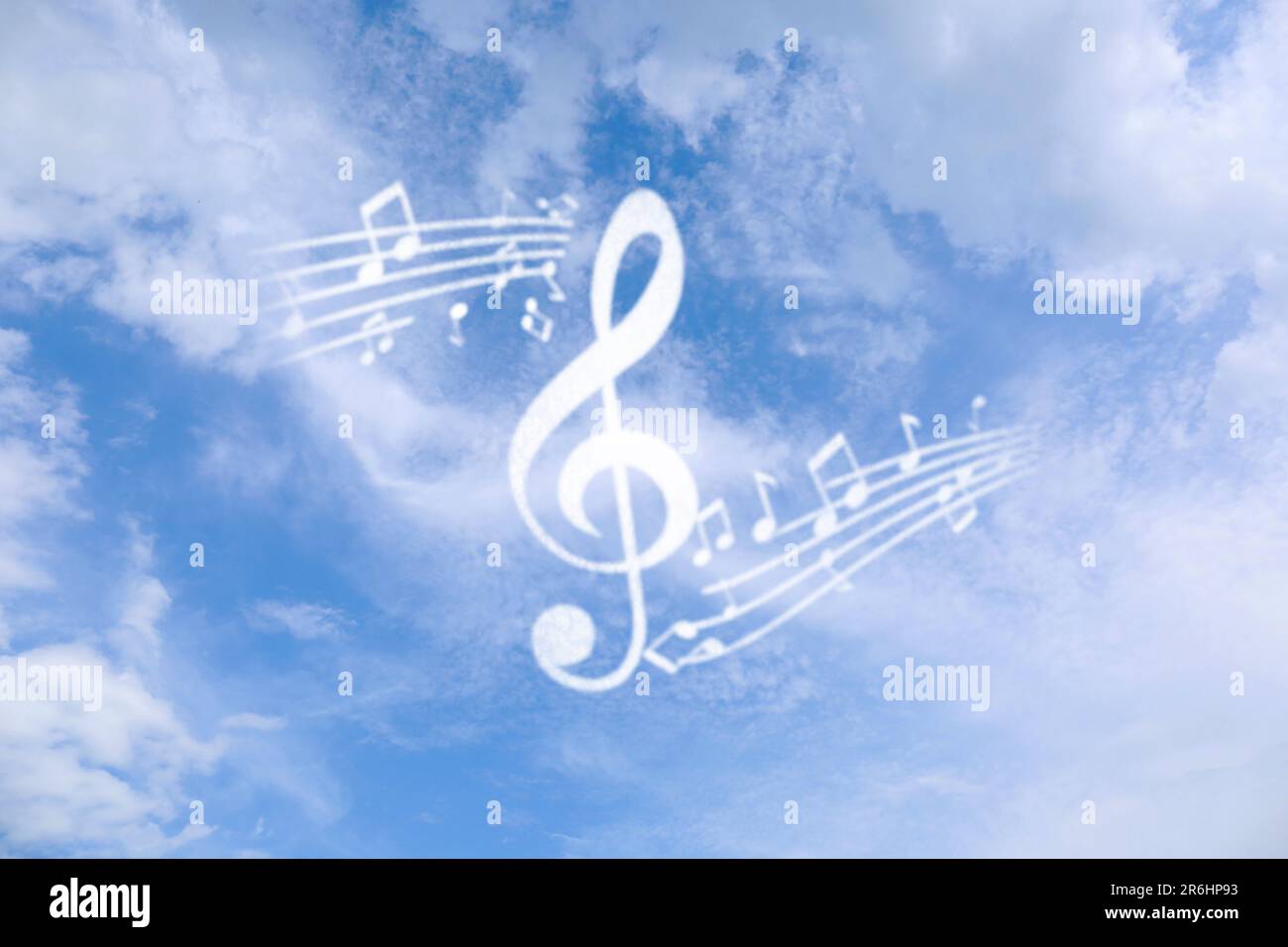 Treble clef and musical notes against sky Stock Photo - Alamy