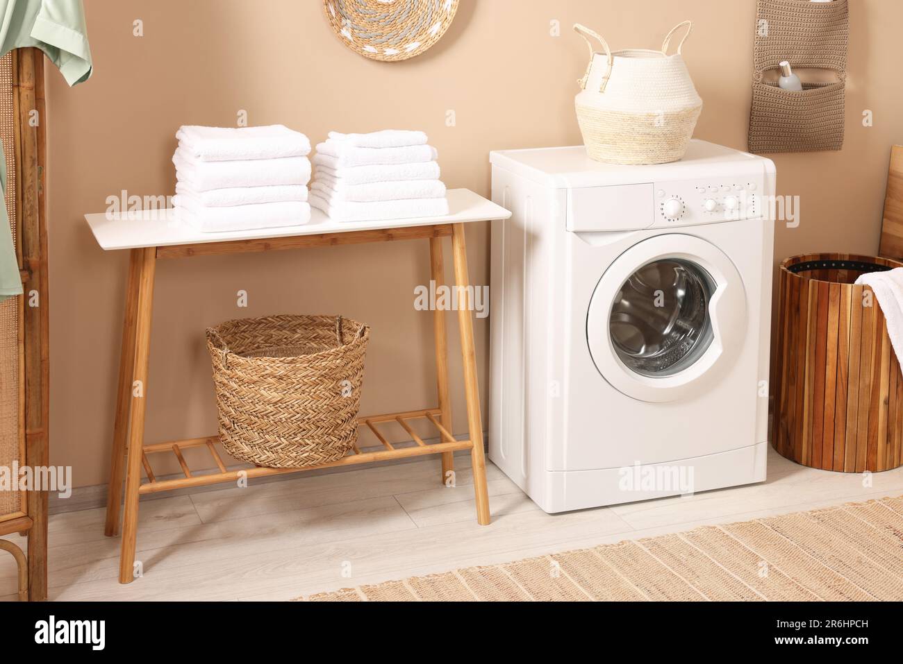 Stylish laundry room with modern washing machine. Interior design Stock ...