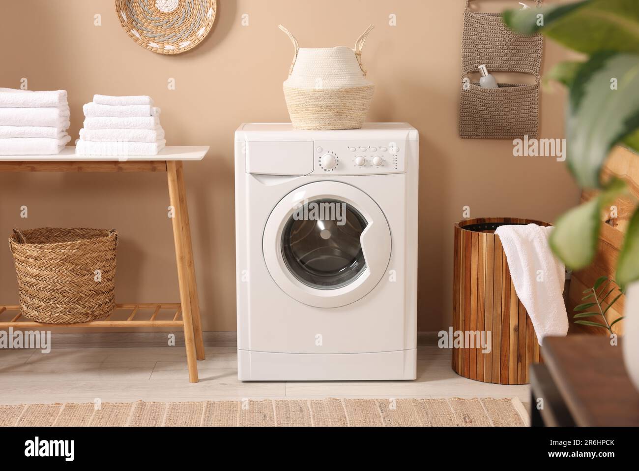 Stylish laundry room with modern washing machine. Interior design Stock ...