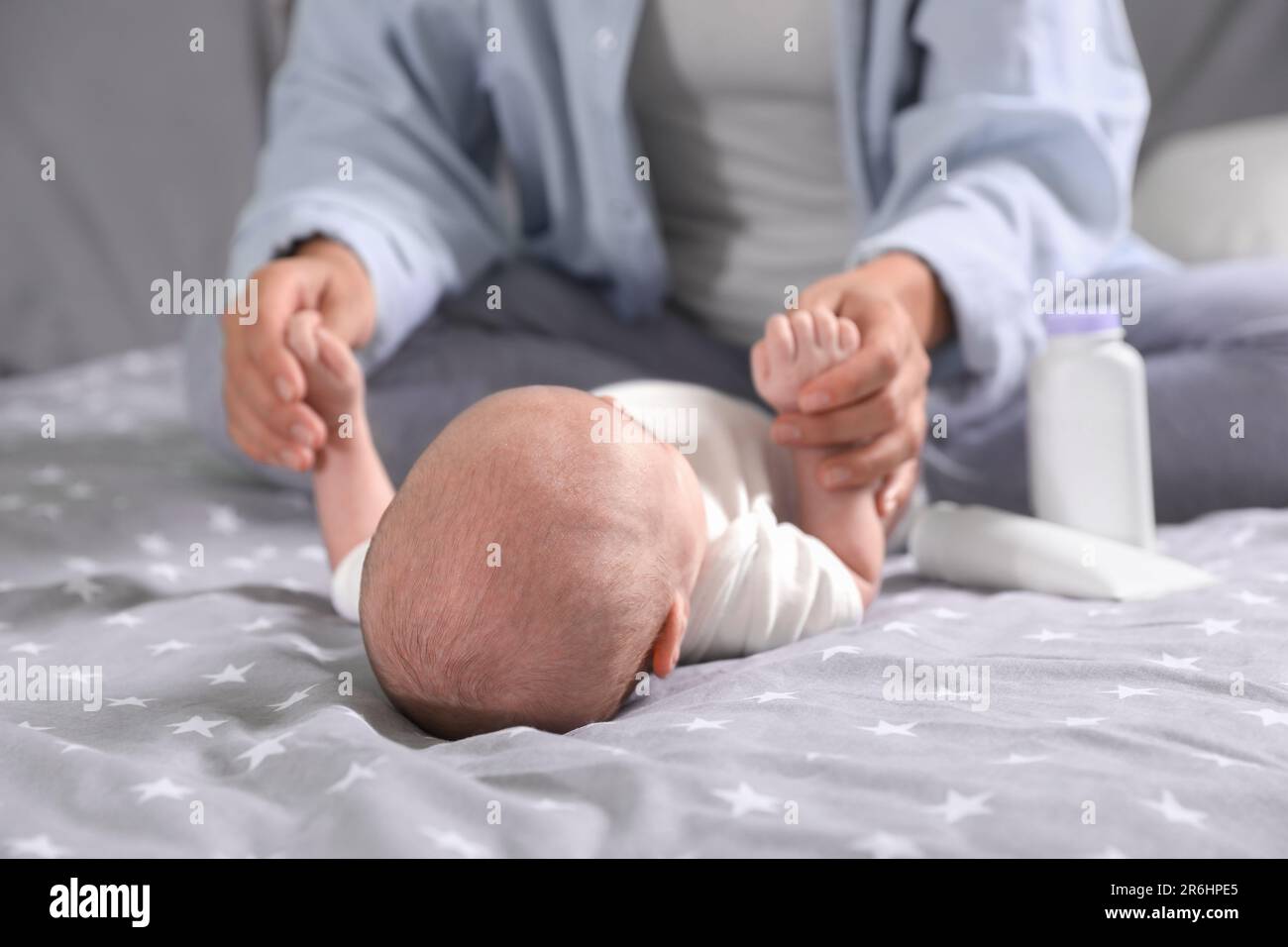 Mother and her little baby on bed, closeup Stock Photo - Alamy