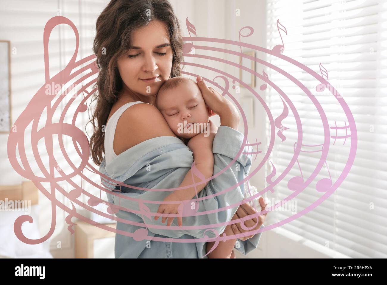 Mother singing lullaby to her sleepy baby at home. Music notes ...