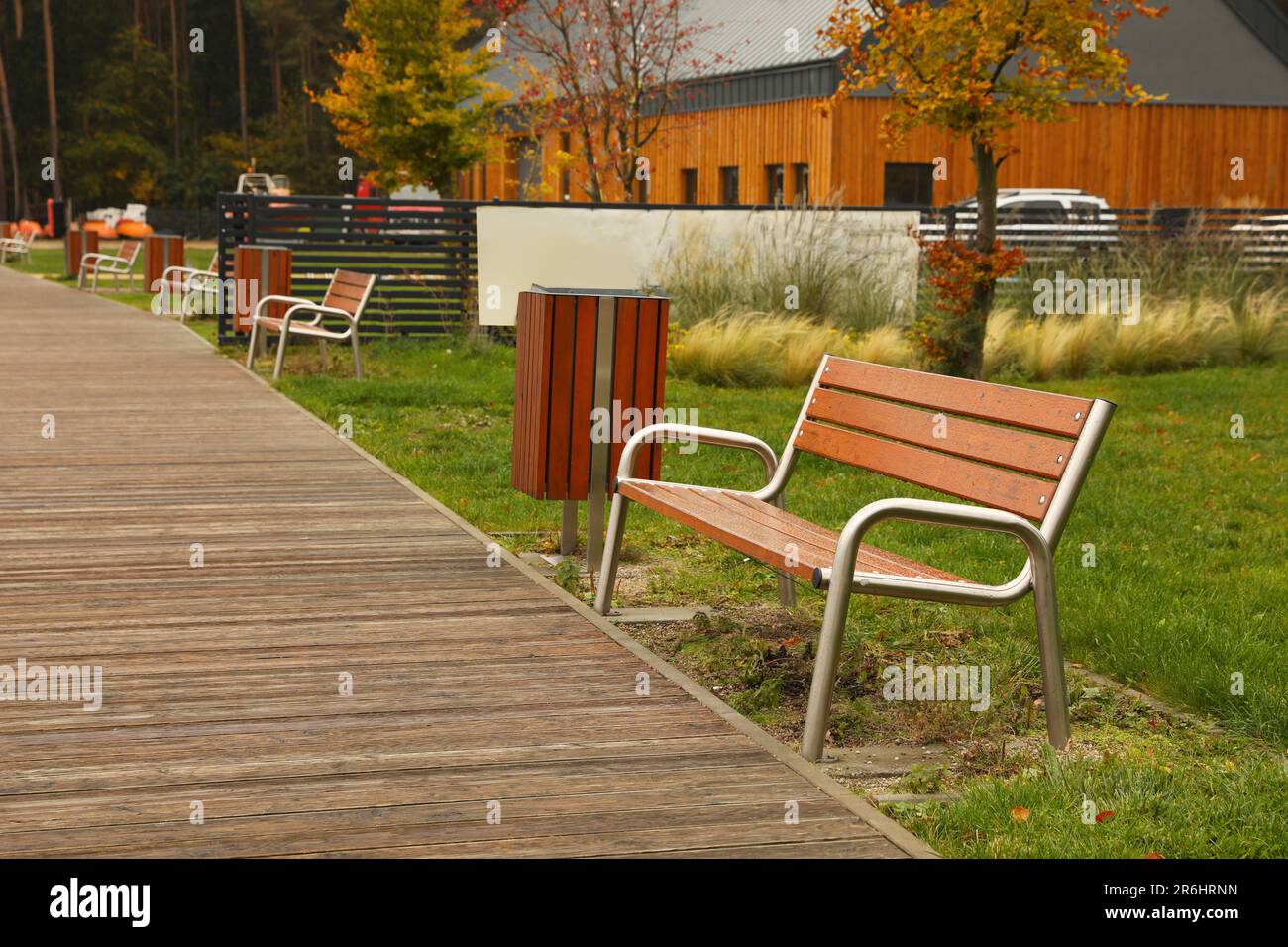 Wooden benches near pathway outdoors. Real estate Stock Photo - Alamy
