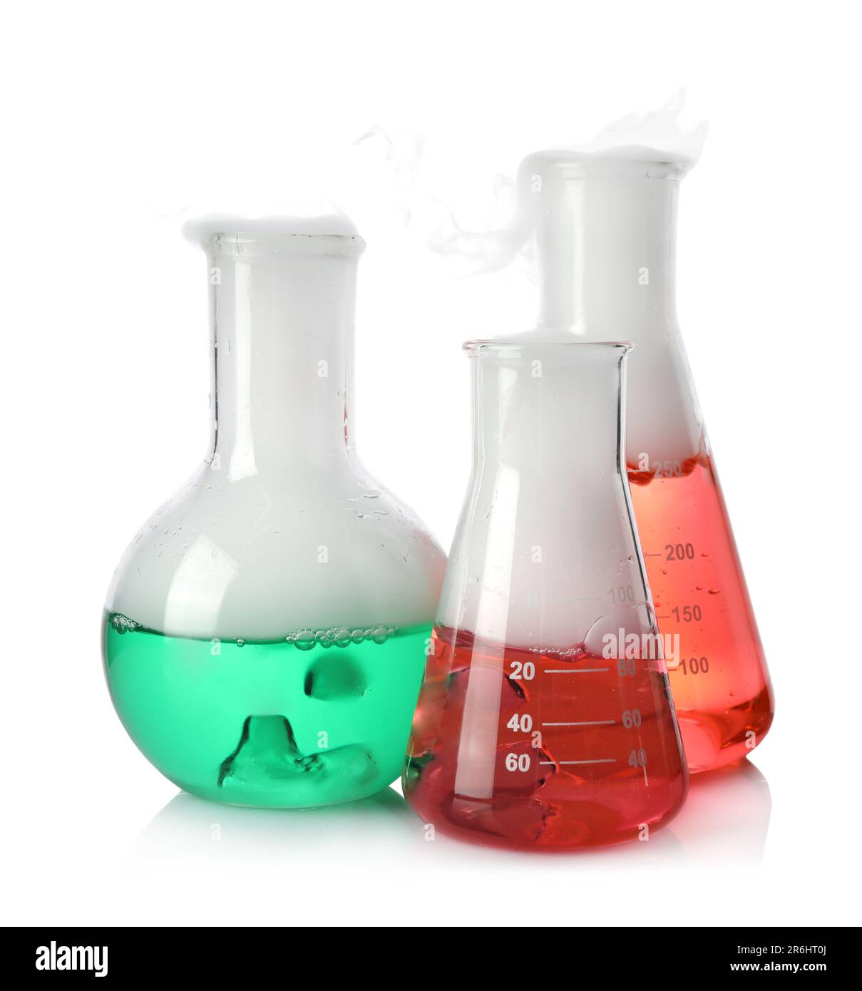 Laboratory flasks with colorful liquids and steam isolated on white ...