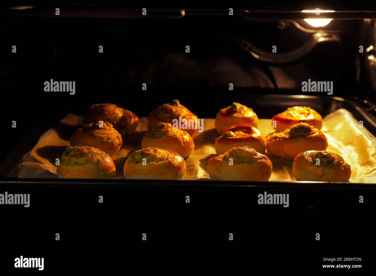 Baking puff pastry with tasty filling in oven Stock Photo - Alamy