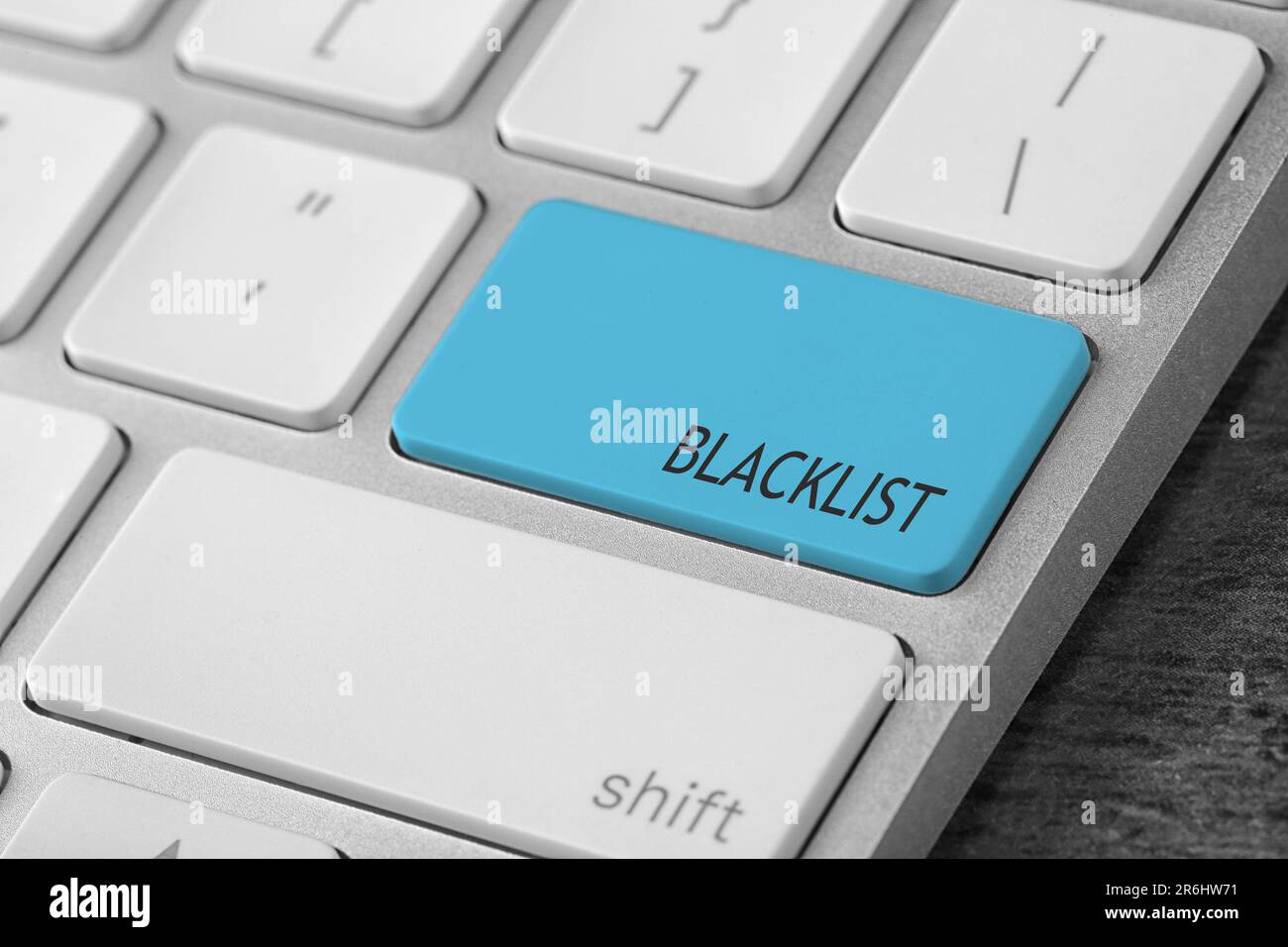 Light blue button with word Blacklist on computer keyboard, closeup ...