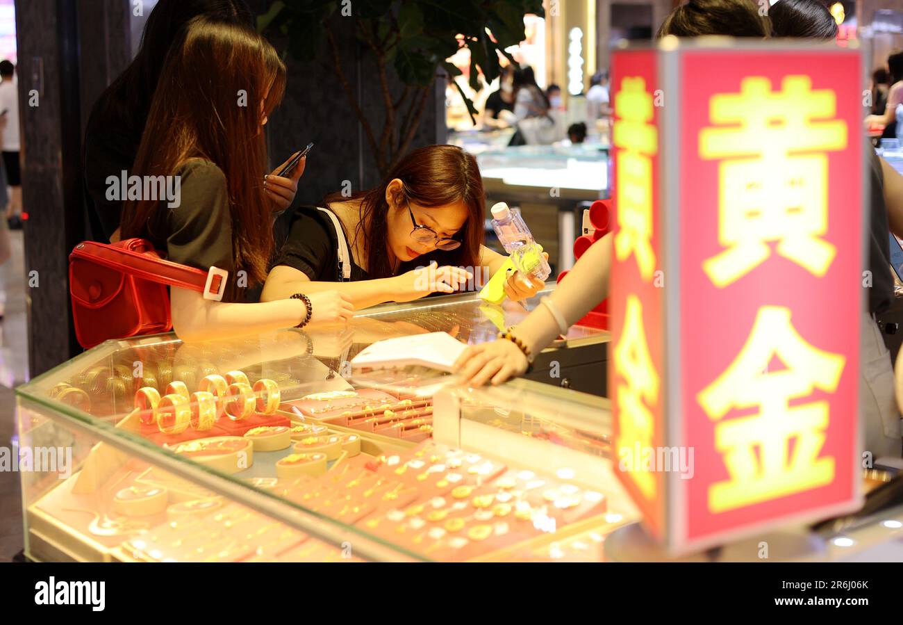 SHENZHEN, CHINA - JUNE 9, 2023 - Consumers shop for gold jewelry at the ...
