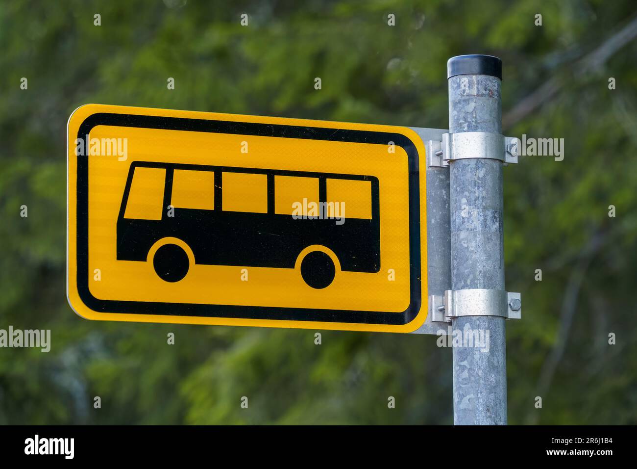 Yellow local bus stop sign in Finland, with green background Stock ...