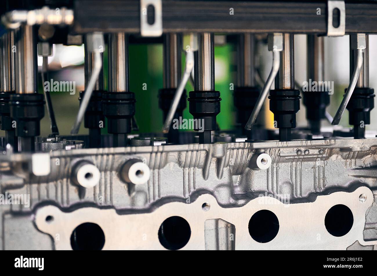 Process of screwing threaded studs into cylinder block case Stock Photo ...