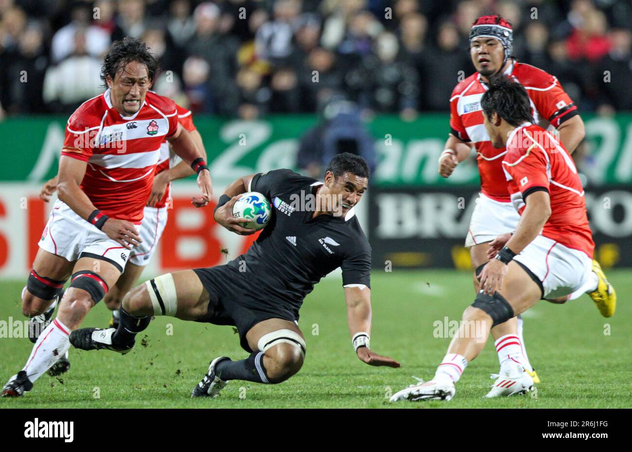 New Zealand’s Jerome Kaino is chased by Japan’s Hitoshi Ono during a ...