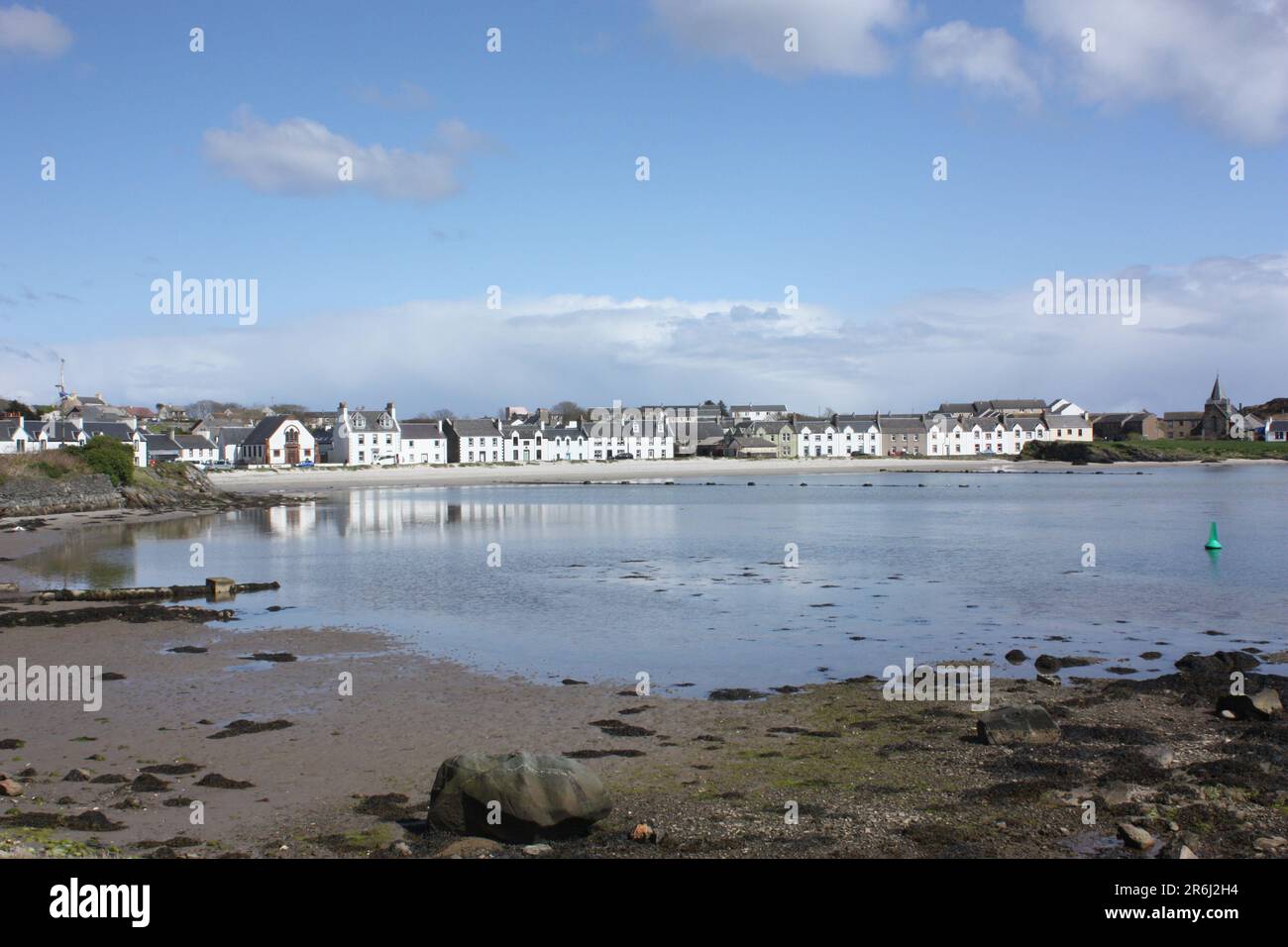 The houses at Port Ellen seen across the small bay on the Isle of Islay ...