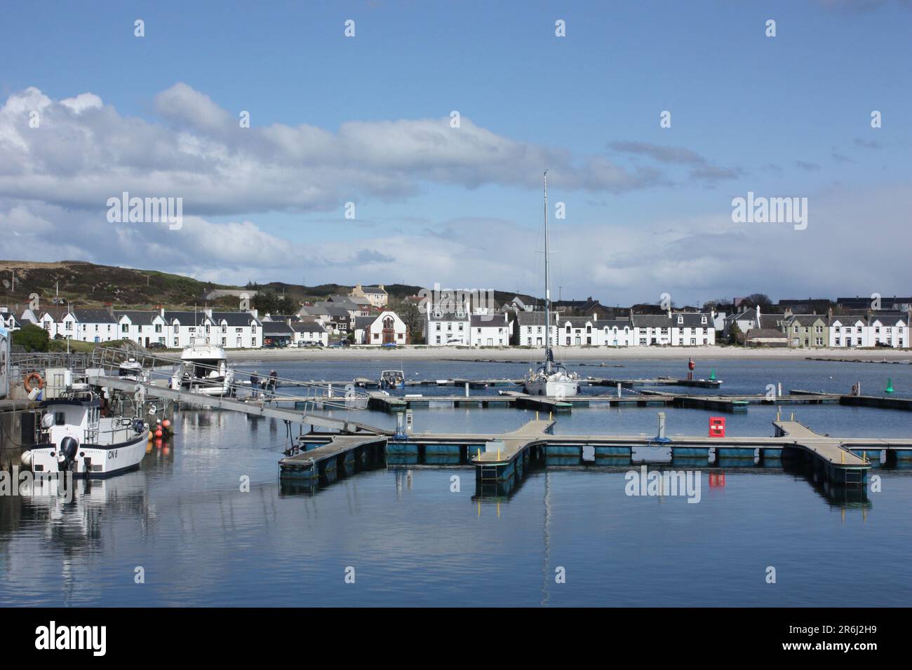 The houses at Port Ellen seen across the marina on the Isle of Islay ...
