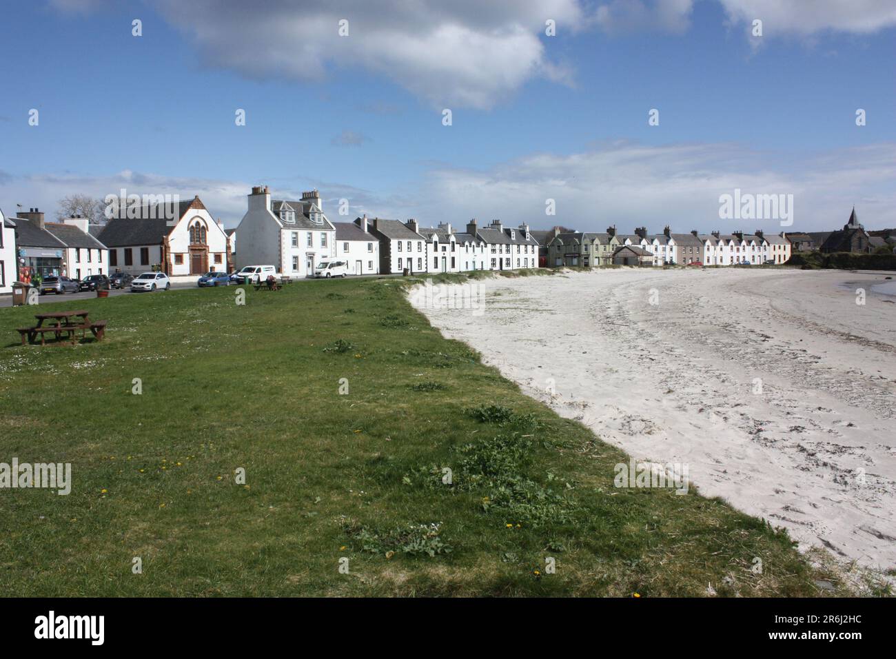 The beach in front of the houses at Port Ellen on the Isle of Islay ...