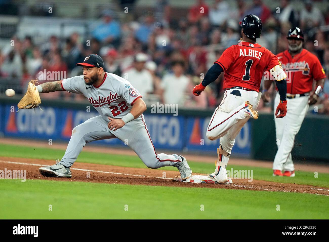 Atlanta Braves' Ozzie Albies (1) is safe on first base after hitting a ...