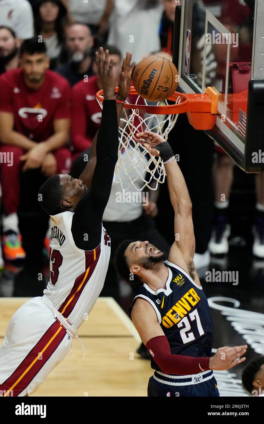 Miami Heat center Bam Adebayo (13) defends Denver Nuggets guard Jamal ...