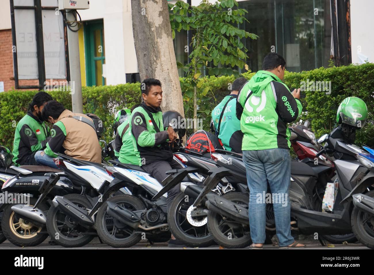 Group of Grab riders wait for customers. Grab is a multinational ride ...