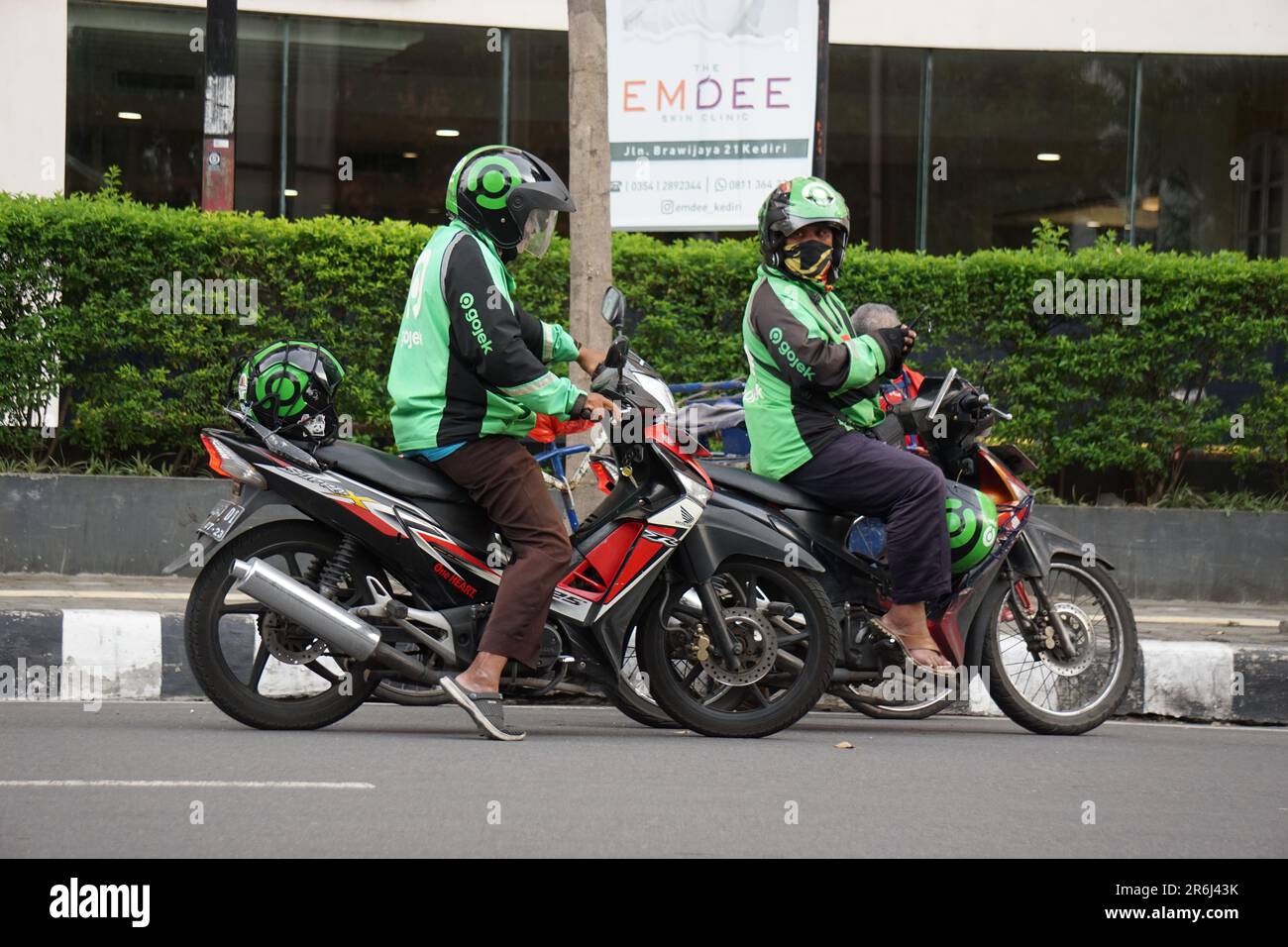 Group of Grab riders wait for customers. Grab is a multinational ride ...