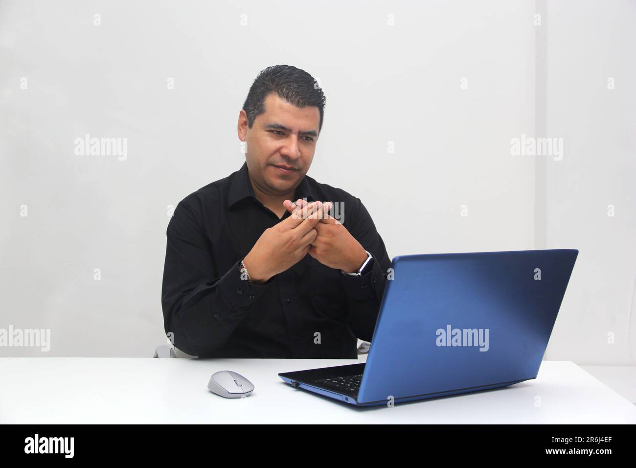 Latino adult man speaks Mexican sign language with a deaf person ...