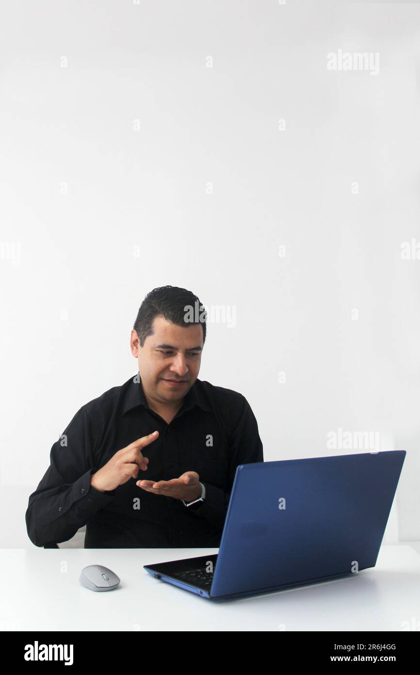 Latino adult man speaks Mexican sign language with a deaf person ...