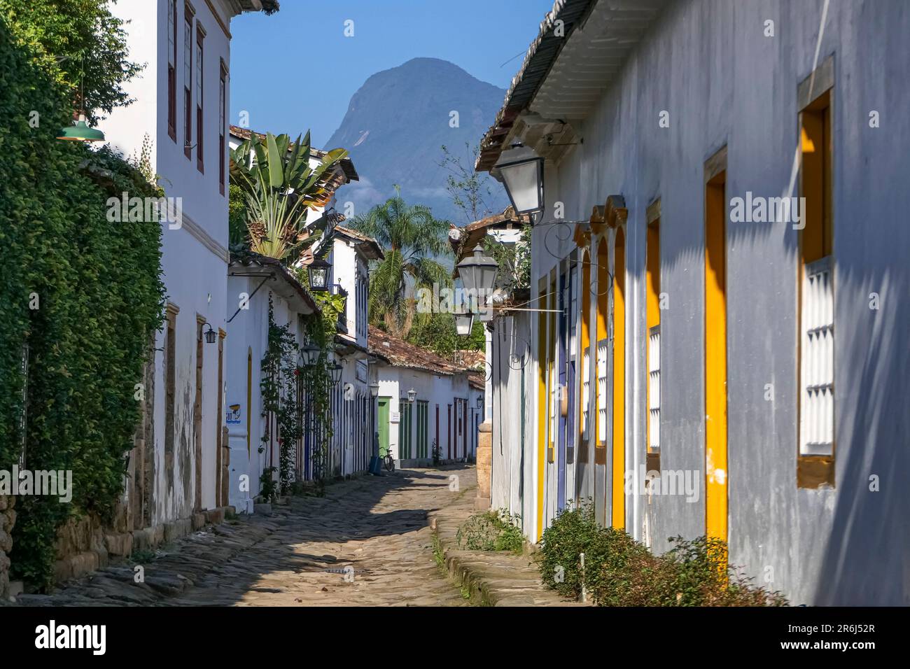 View to mountain through a typical cobblestone street with colonial ...