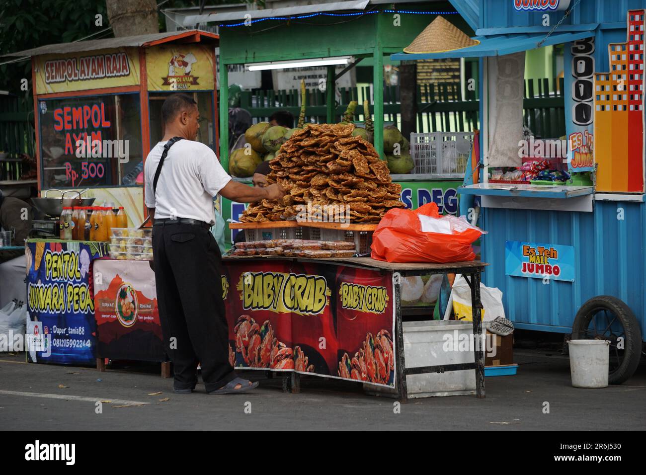 The seller of peyek. Peyek is one of Indonesian traditional crackers ...