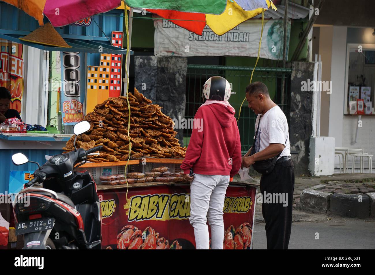 The seller of peyek. Peyek is one of Indonesian traditional crackers ...