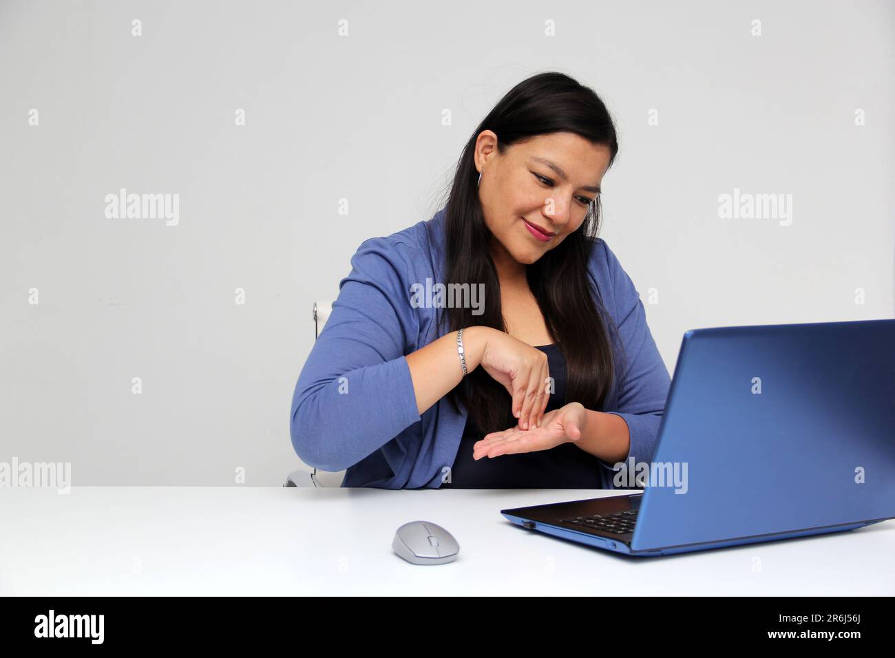 Latino adult woman speaks Mexican sign language with a deaf person ...