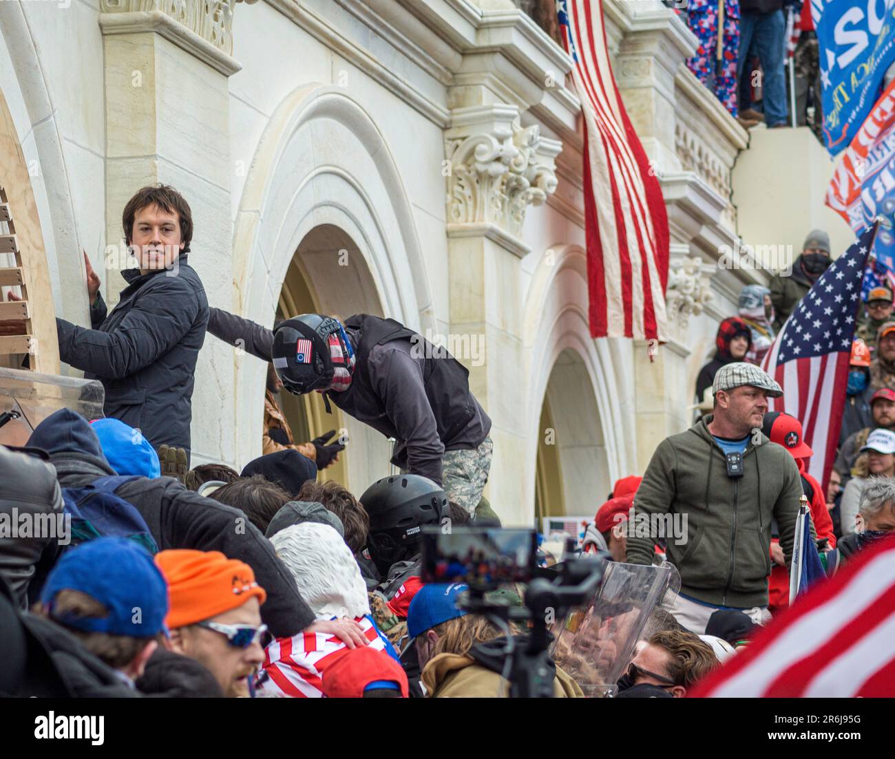 David Dempsey, seen here wearing a helmet and flag gaitor, assaults ...