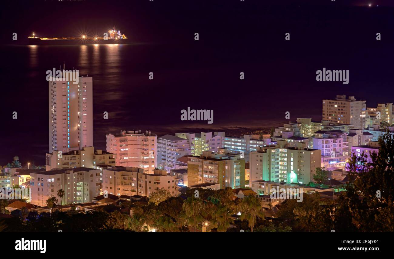 Lights, buildings and city at night with a harbour for urban ...