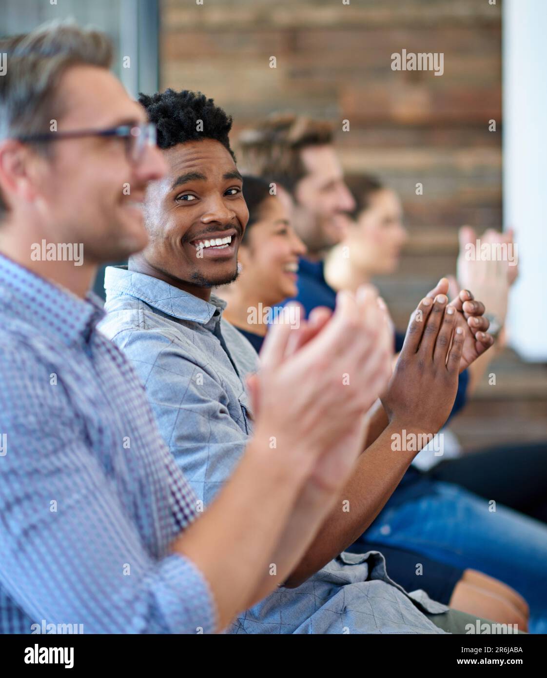 Diversity, colleagues with applause and in a meeting room of their ...
