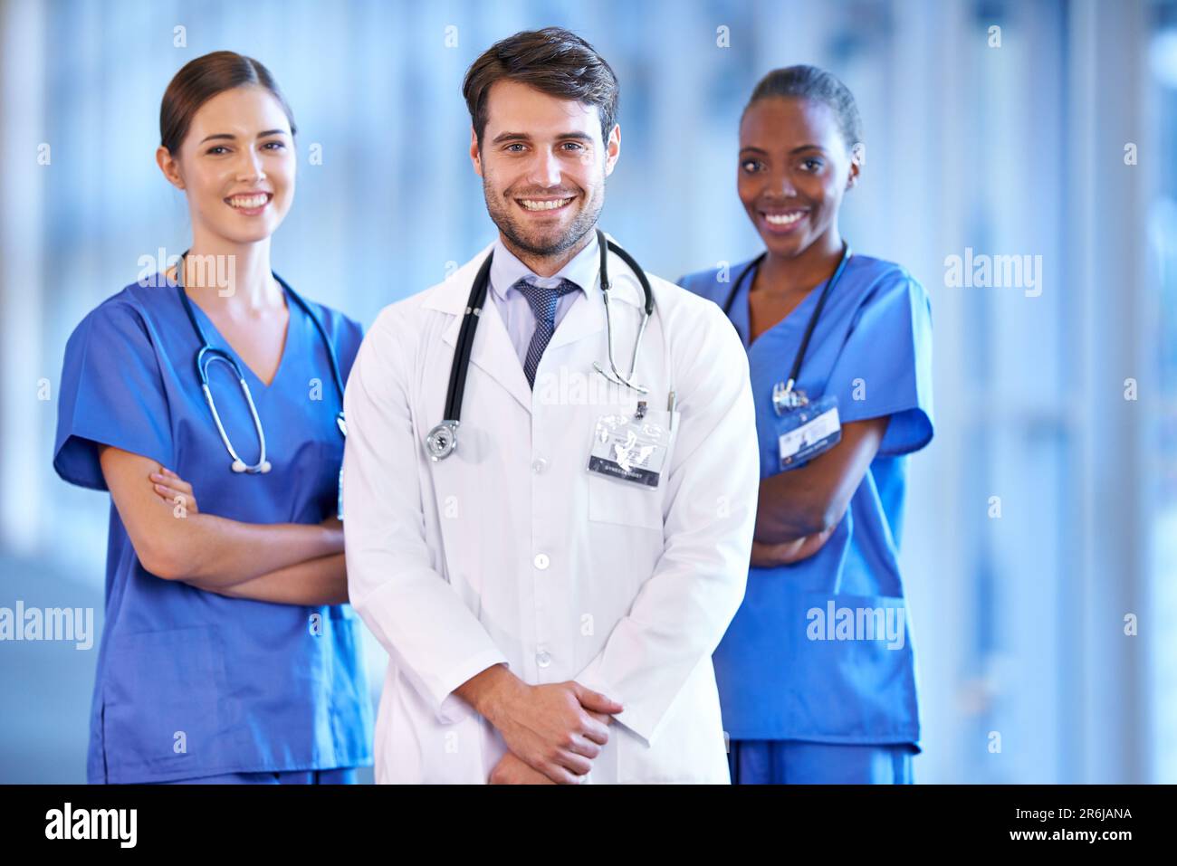 Medical, collaboration and portrait of doctor with nurses standing in a ...