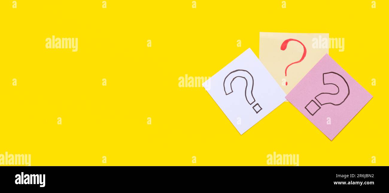 Sticky notes with question marks on yellow background with space for ...