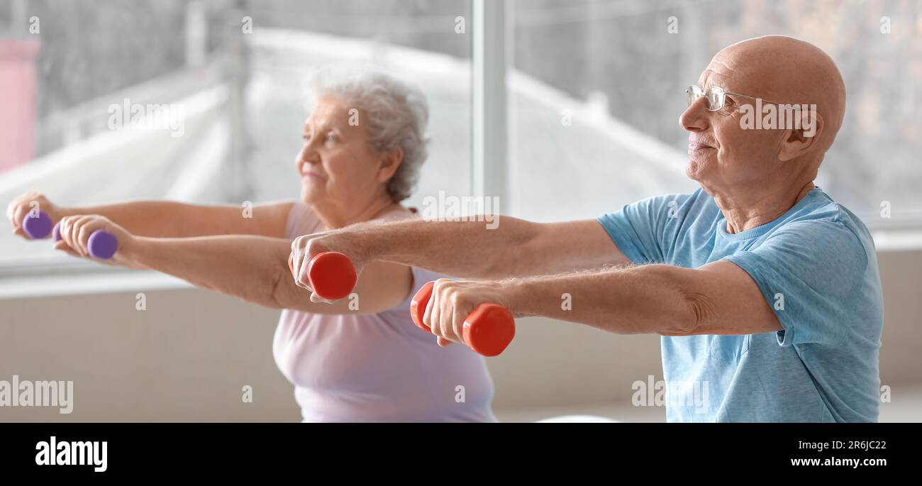Old woman flexibility exercises hi-res stock photography and images - Alamy