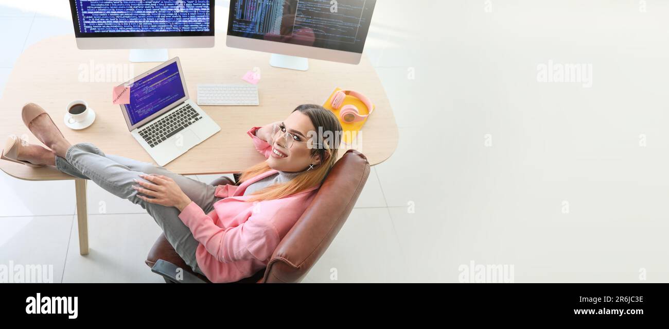 Transgender programmer working in office. Banner for design Stock Photo ...