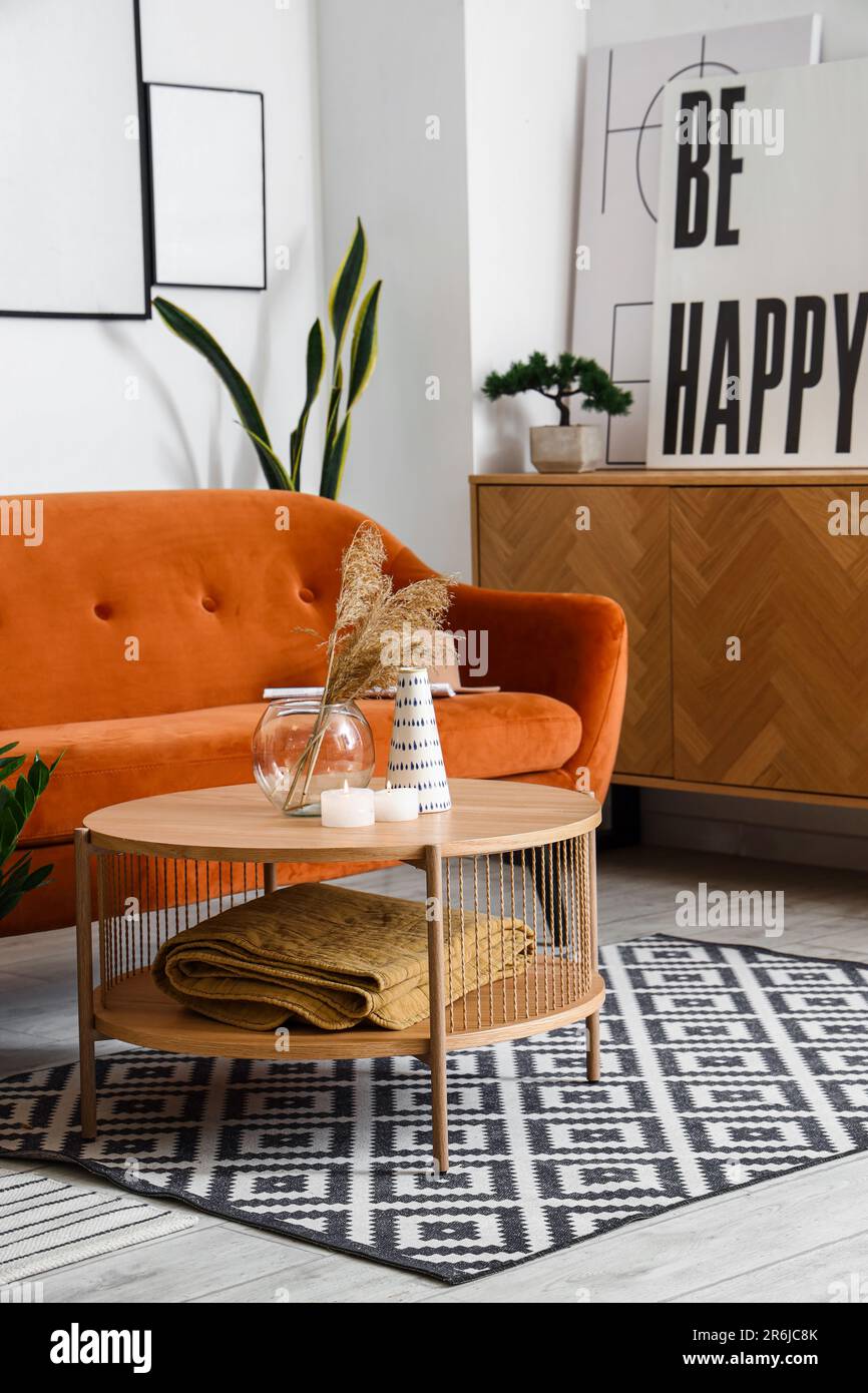 Interior of light living room with coffee table and sofa Stock Photo ...