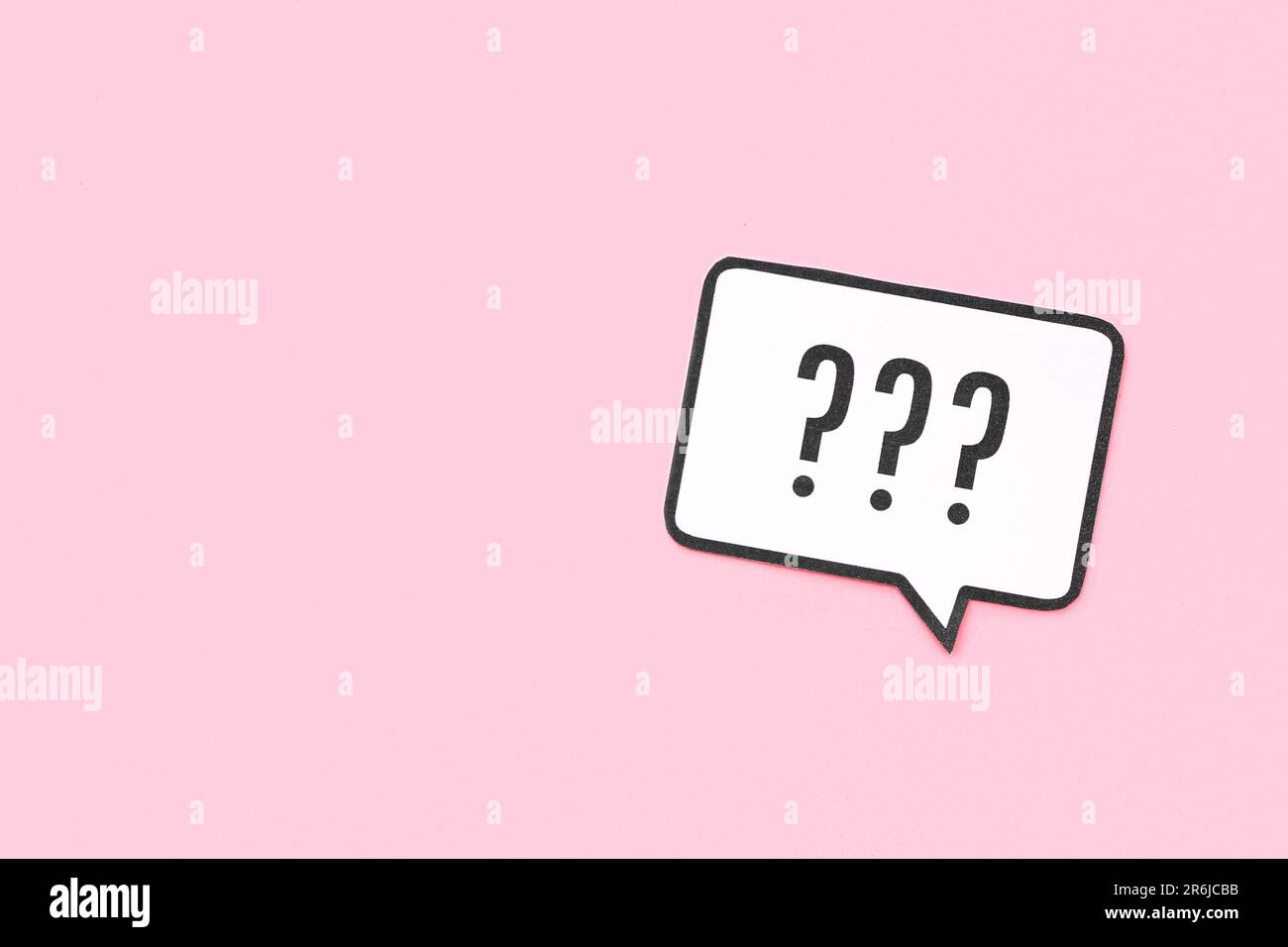 Speech bubble with question mark on pink background Stock Photo - Alamy